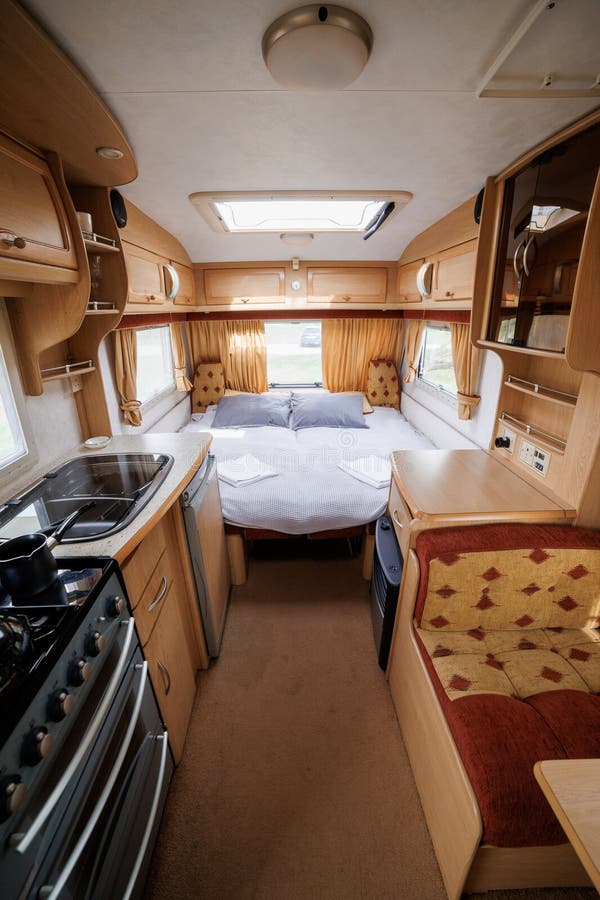 Cozy Caravan Interior with Kitchen and Sleeping Area. Ideal for ...