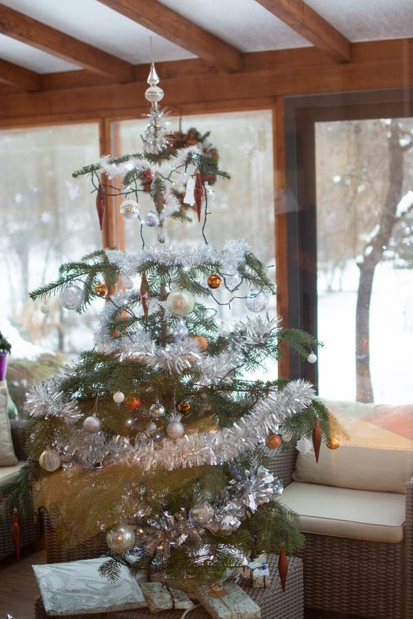 A Cozy Christmas Scene Featuring a Small, Decorated Tree Stock Photo ...