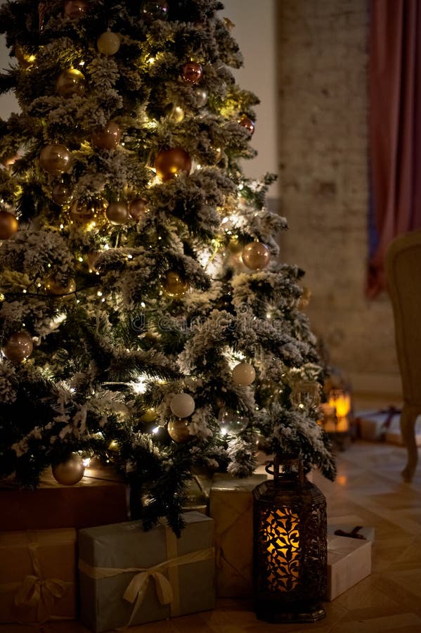 Cozy Christmas Tree with Christmas Lights and Boxes of Presents. Warm ...