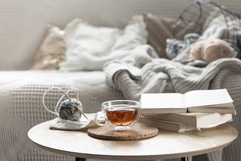 Cozy Composition with a Cup of Tea, a Candle and Knitted Elements ...