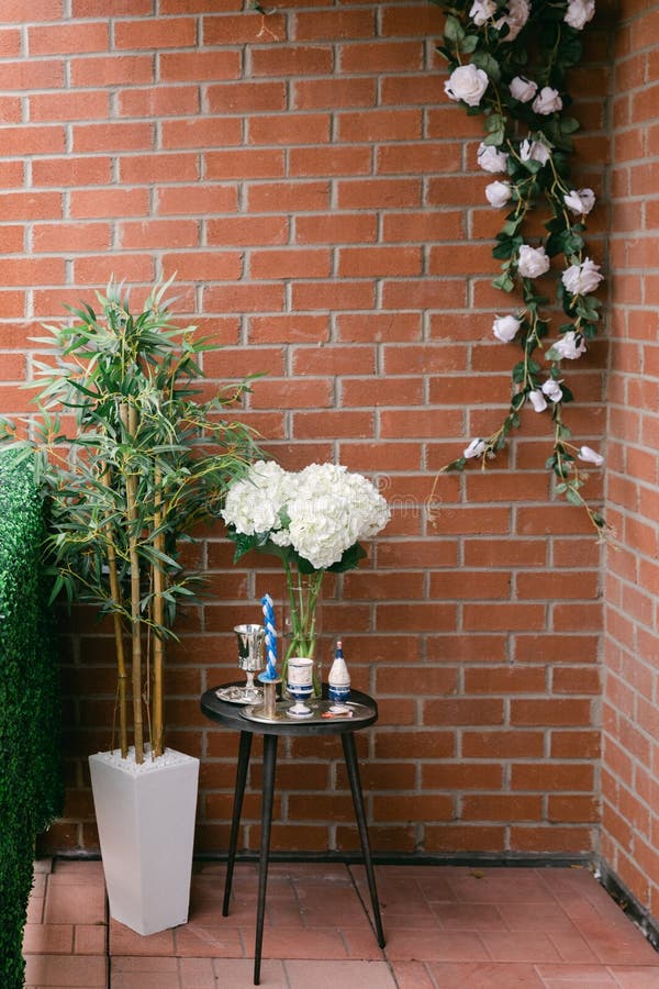 Charming Corner Decor with Flowers, Plants, and Decorative Items in ...