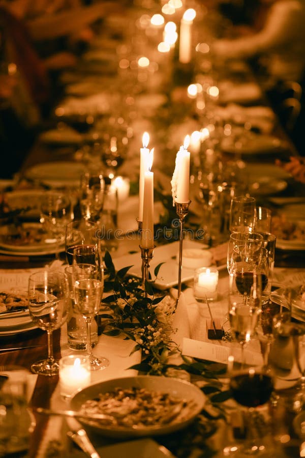 Elegant Candlelit Dinner Gathering with Beautifully Set Table Adorned ...