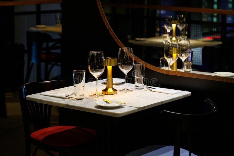 A Cozy and Elegant Table Setting for a Romantic Dinner in a Dimly Lit ...