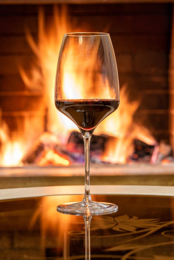 Cozy Fireplace Scene and Glass of Red Wine Stock Image - Image of ...