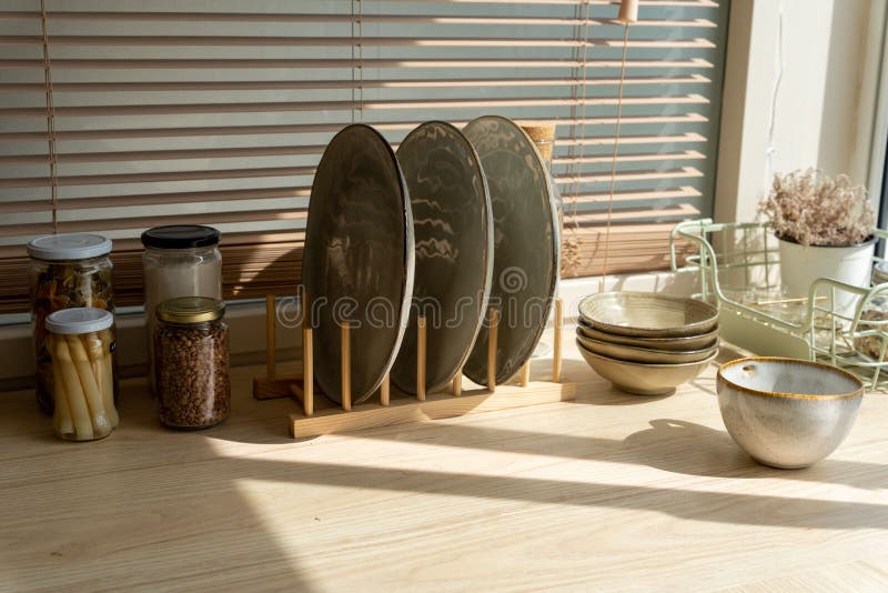 Cozy Interior of a Modern Kitchen with Plates on the Counter Stock ...