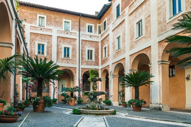 Cozy Italian Courtyard with Fountain Editorial Stock Photo - Image of ...