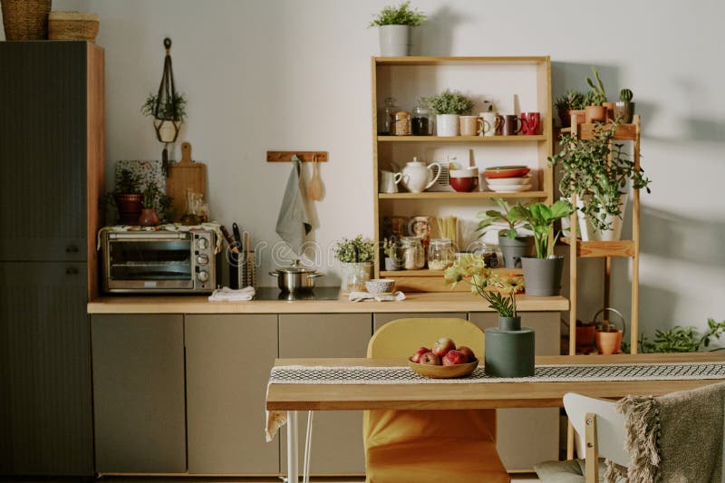 Cozy Kitchen Featuring Minimalist Design and Greenery Stock Image ...