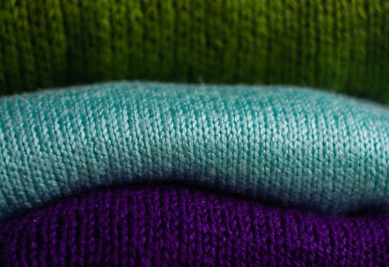Cozy Knitted Sweaters of Different Colors are Stacked on Top of Each ...