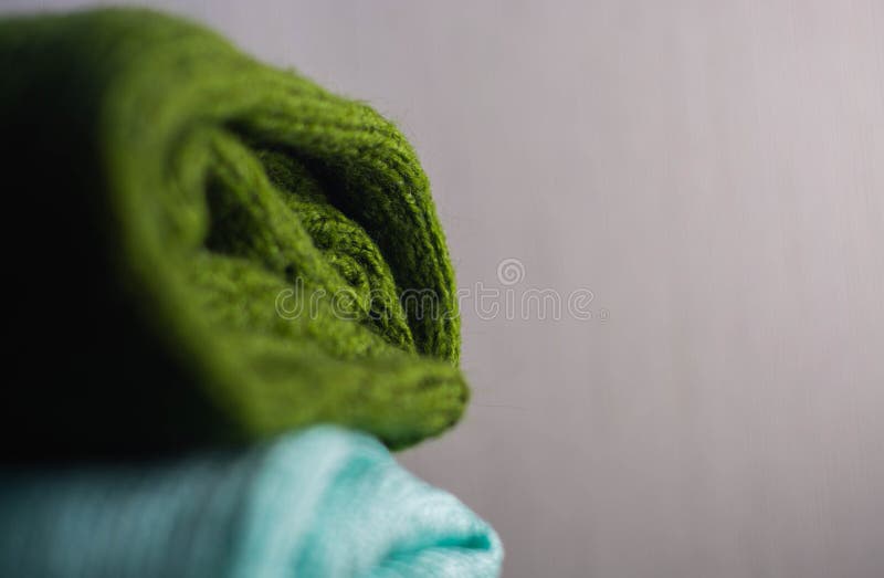 Cozy Knitted Sweaters of Different Colors are Stacked on Top of Each ...