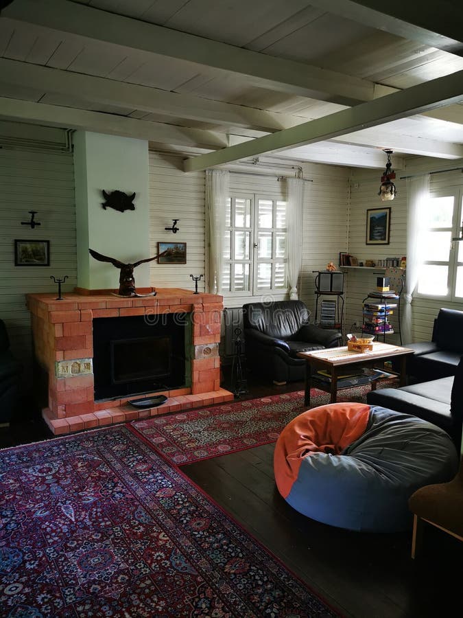 Cozy Living Room with a Fireplace and Comfortable Seating in a Rustic ...