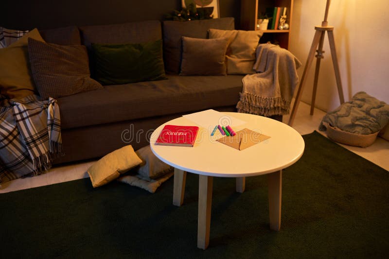 Cozy Living Room with Study Setup and Soft Lighting Stock Image - Image ...