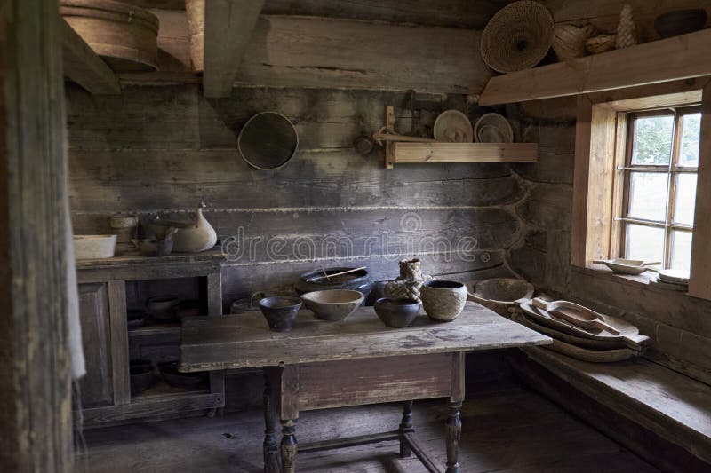 A Cozy Log Cabin Kitchen with a Table and Chairs for Dining Stock Photo ...