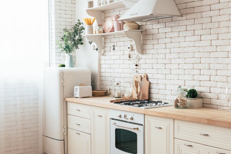 Cozy Modern Kitchen with Cooking Utensils and Plants. Stock Photo ...