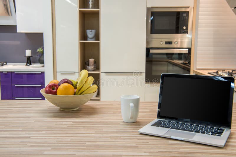 Cozy Modern Kitchen Interior with Laptop and Fruits Stock Photo - Image ...