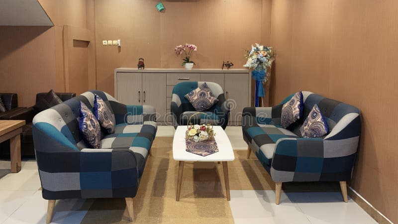 Cozy Modern Living Room with Patchwork Sofas and Warm Lighting. Stock ...