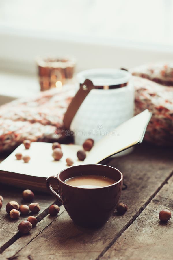 Cozy Morning at Home, Coffee and Book with Nuts on Table, Selective ...