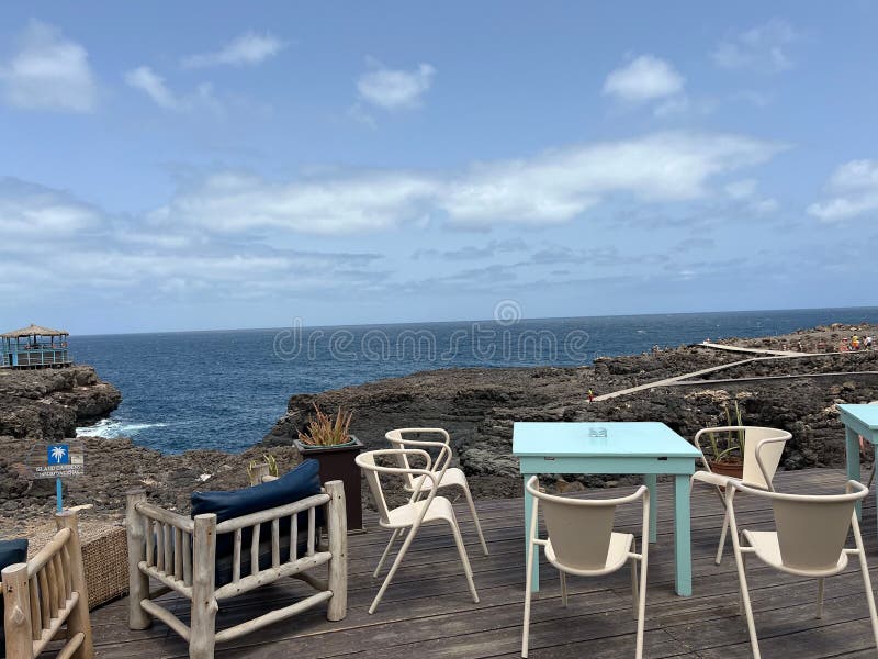 Cozy Outdoor Cafe with Sea View on a Cloudy Day Stock Photo - Image of ...