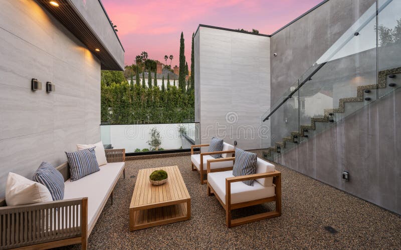 Cozy Outdoor Lounge Area beside a Staircase Stock Photo - Image of cozy ...