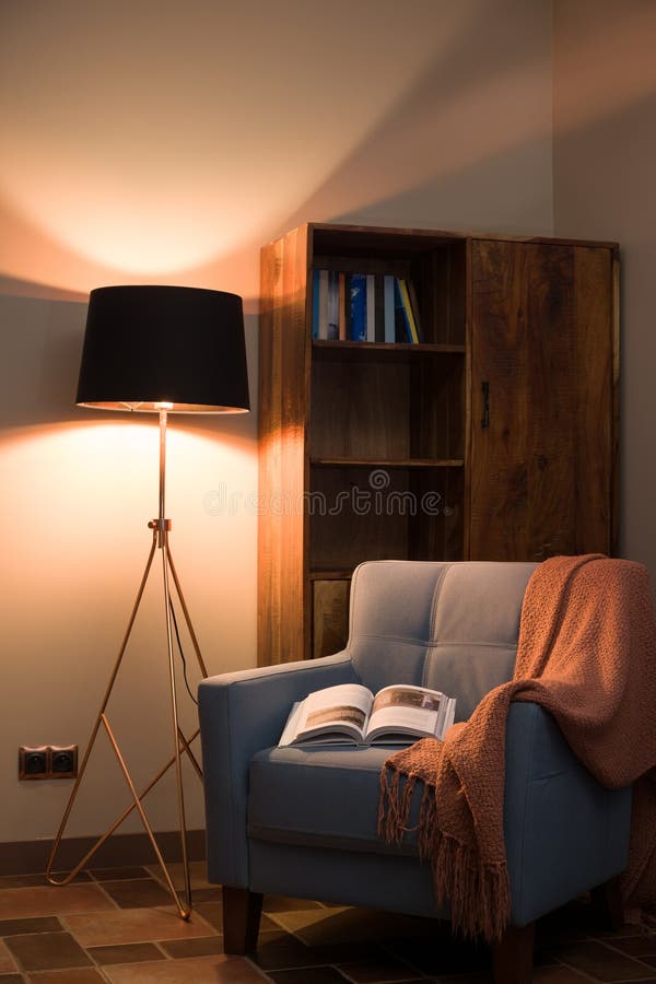 Cozy Reading Corner with Armchair, Book, and Lamp Stock Image - Image ...