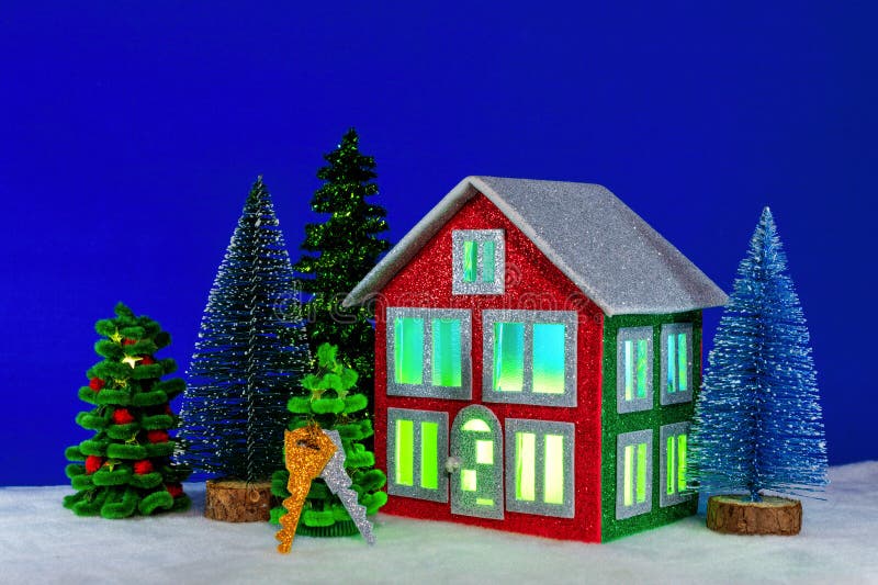 Cozy Red House with Green Light in the Windows and Keys Under the Tree ...