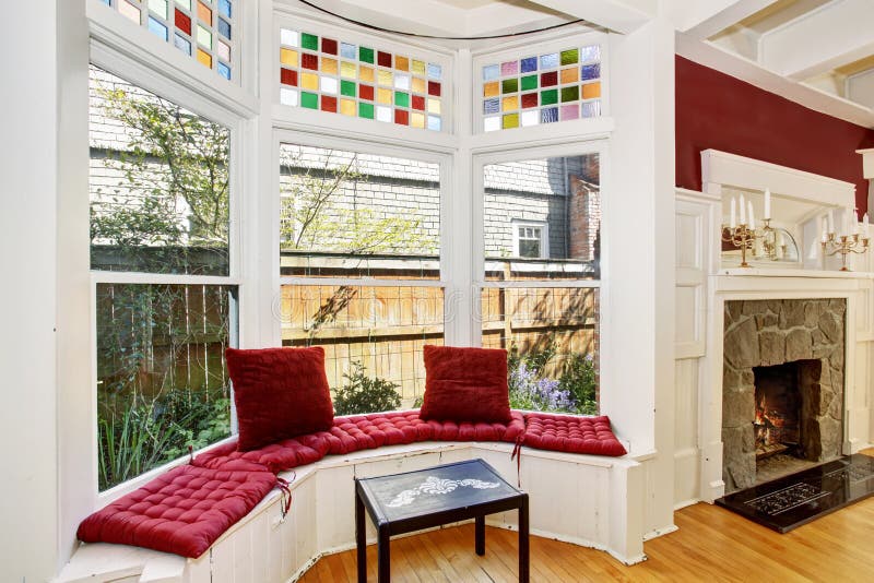 Cozy Sitting Area with Wide Decorative Windows and Red Pillows. Stock ...