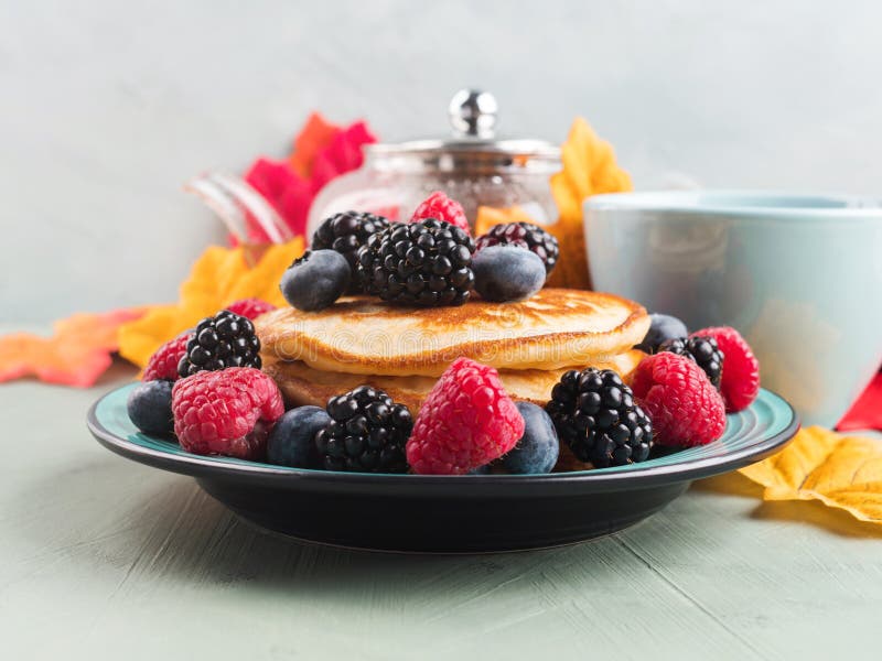 Cozy Snack Breakfast with Stack of Pancakes and Berries with Green Tea ...
