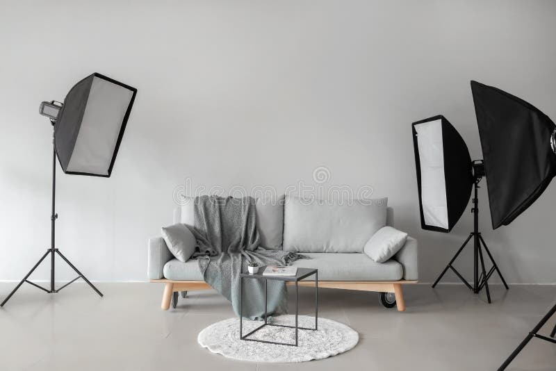Cozy Sofa and Table in Photo Studio with Professional Equipment Stock ...