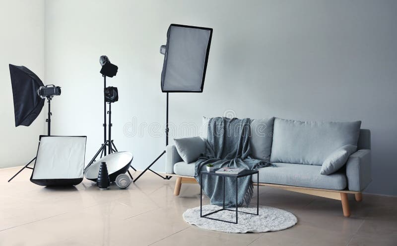 Cozy Sofa and Table in Photo Studio with Professional Equipment Stock ...