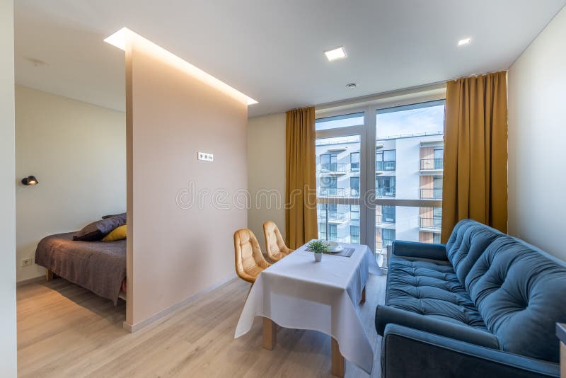 Modern Studio Apartment Interior Design with Bright Windows and Cozy ...