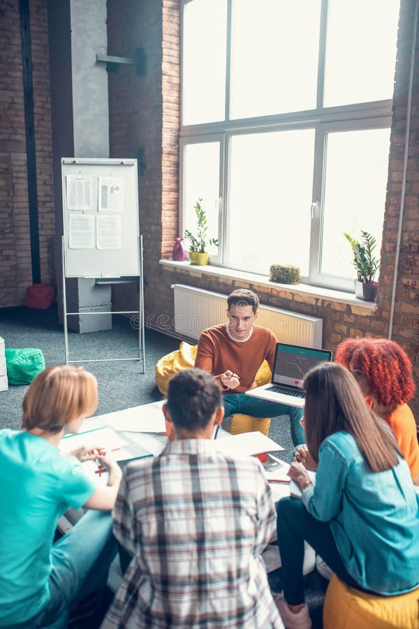 Students Sitting in Cozy Work Hub and Preparing for Group Project Stock ...