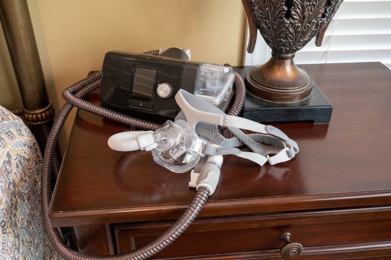 CPAP Machine and Face Mask Sitting on Night Stand Stock Photo - Image ...