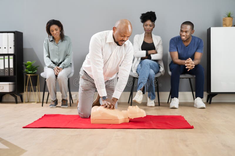 CPR First Aid Lifeguard or Paramedic Class Stock Photo - Image of afro ...