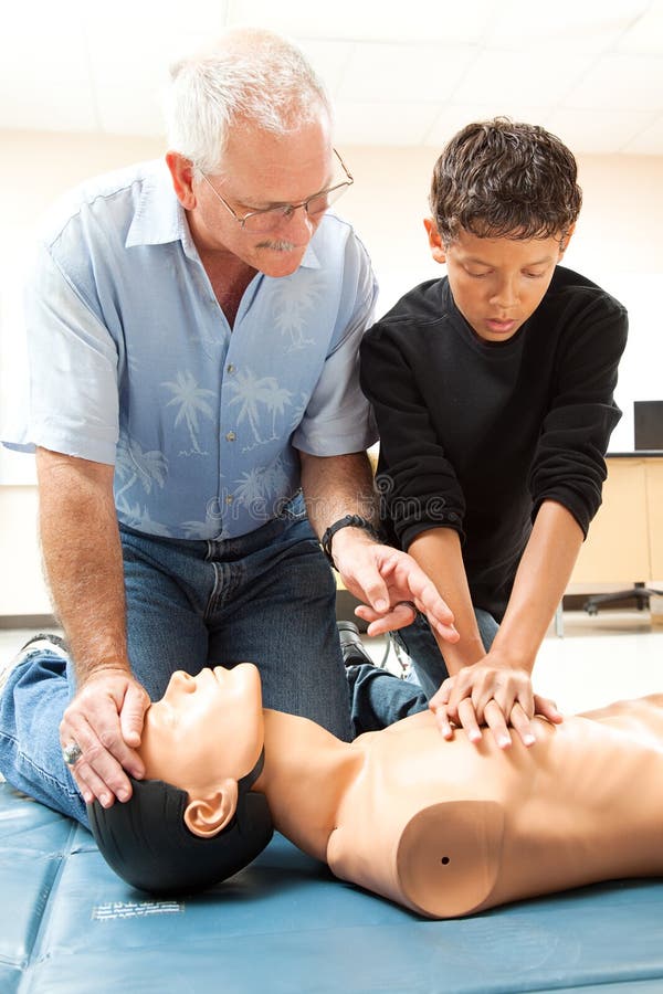 CPR Instruction in School stock image. Image of compression - 20878259