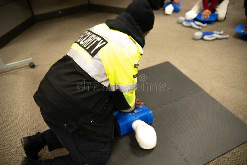 CPR Training Class by Security Guard in Office Stock Photo - Image of ...