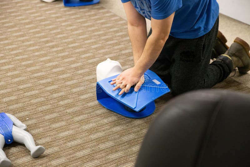 CPR Training Class by Security Guard in Office Stock Photo - Image of ...