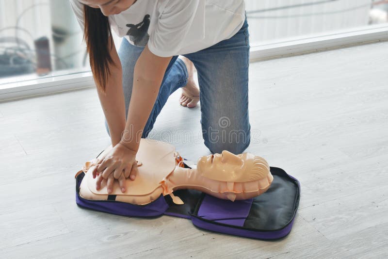 Cpr Training. Close-up of Trainee`s Hand Pump on Chest of Dummy on CPR ...