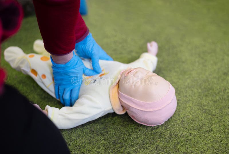 CPR Training on an Infant Training Manikin Stock Image - Image of help ...