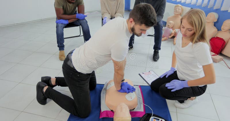 CPR Training Medical Procedure Workshop. Demonstrating Chest ...