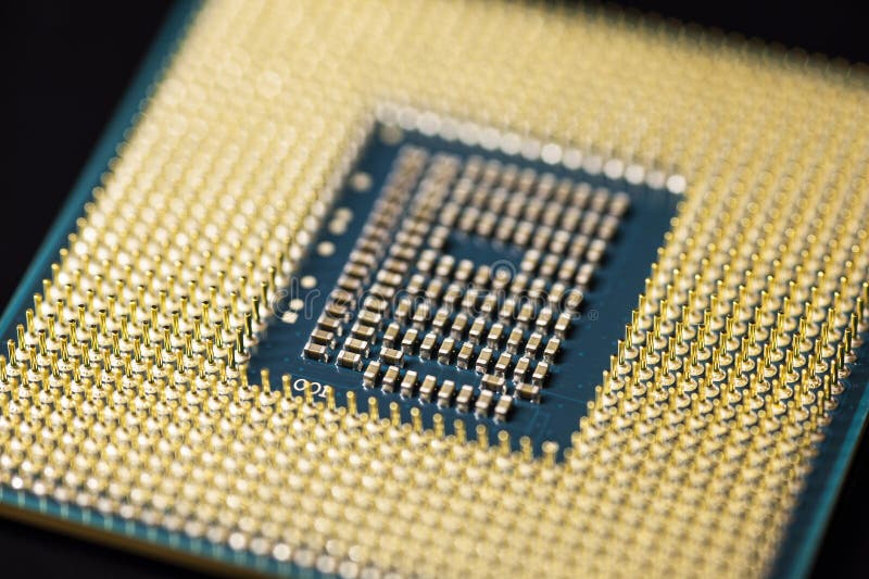 Cpu with Gold Pins Facing Up, Showing the Complex Circuitry on a Blue ...