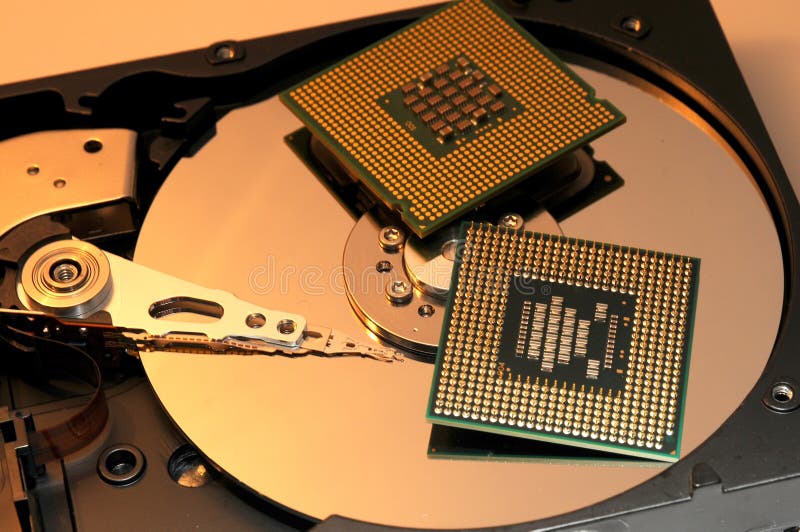 CPU Processors on Reflective Hard Disk Plate. Stock Photo - Image of ...