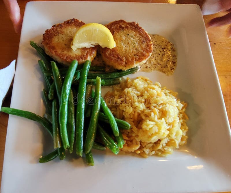 Crab Cakes with Green Beans and Rice Plate Stock Photo - Image of ...