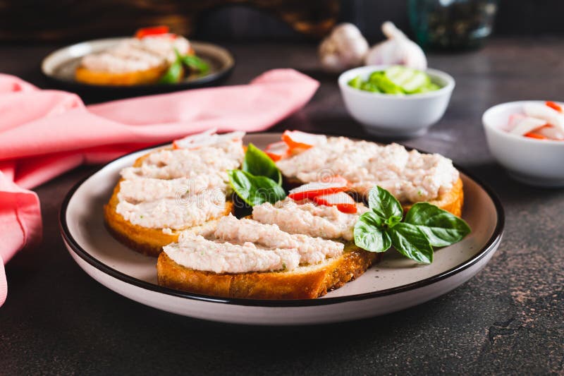 Crab Stick and Cucumber Pate on Toast on a Plate on the Table Stock ...