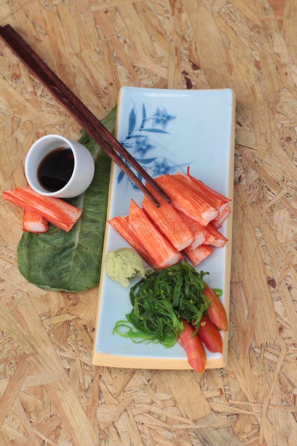 Crab sticks on a plate stock image. Image of green, closeup - 56334449