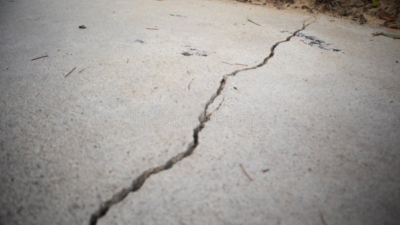 Crack in Concrete Surface the Image Shows a Close-up View of a Crack in ...
