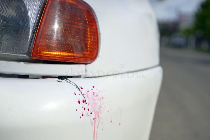 A Crack and Drops of Blood on the Front Bumper of a White Old Car Stock ...