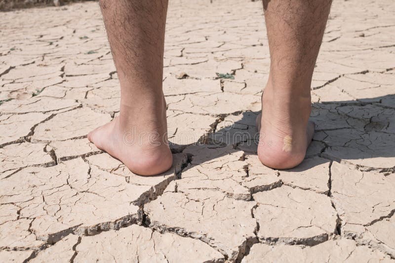 Crack dry ground on foot. stock photo. Image of close - 95279020