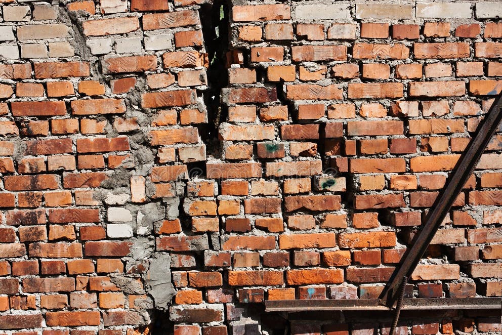 Crack in the brick wall stock photo. Image of metallic - 204101864