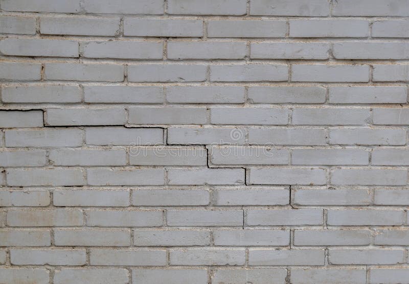 Cracked Brick Wall with Visible Damage Stock Photo - Image of ...