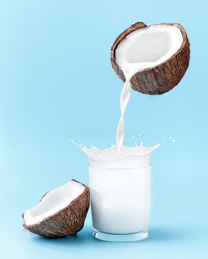 Coconut with Milk Splash on Blue Background, Splashing Milk in Coconut ...