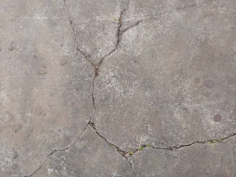 Cracked Concrete Surface with a Linear Pattern, Illuminated by Natural ...